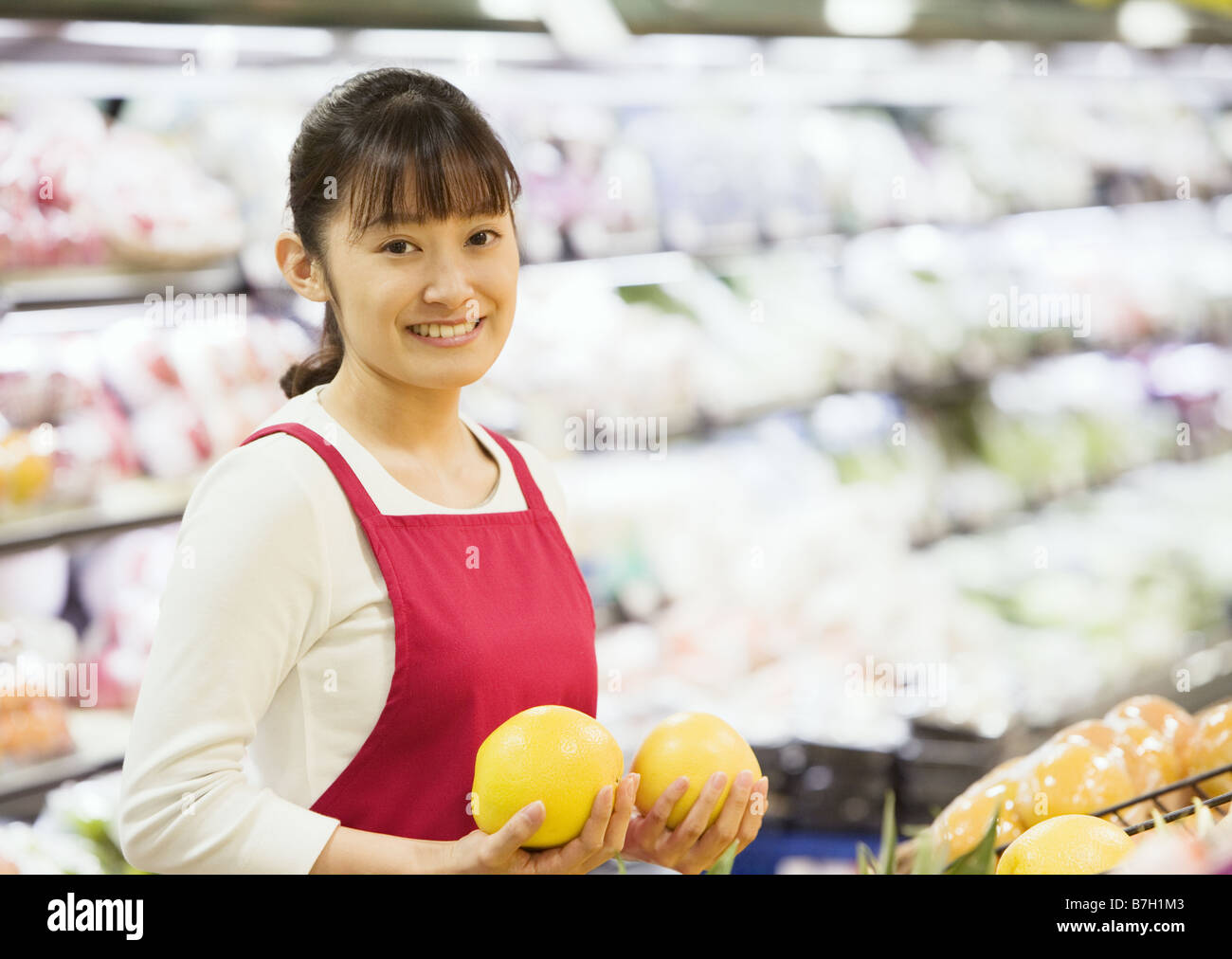 A supermarket store clerk Stock Photo - Alamy