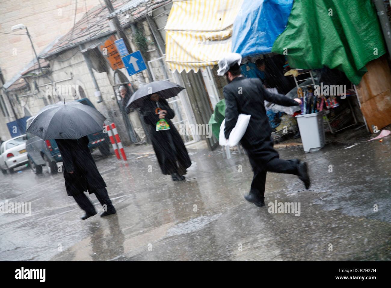 Religious Jews running through the streets of Mea Shearim a religious ...