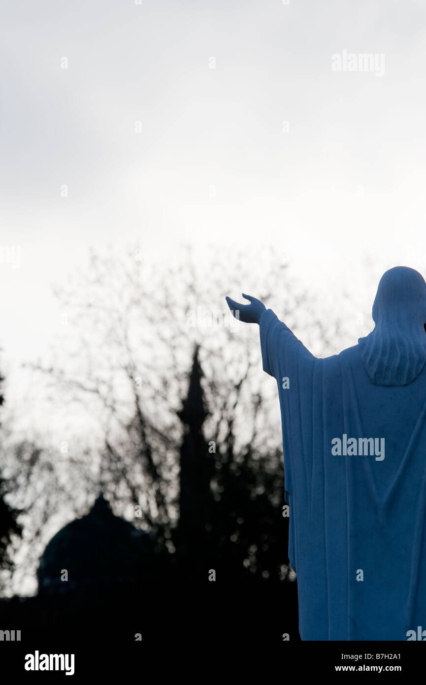 Jesus is watching over the North Watford mosque from the cemetery Stock ...