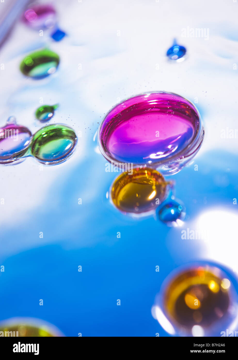 Glass balls floating on water Stock Photo - Alamy