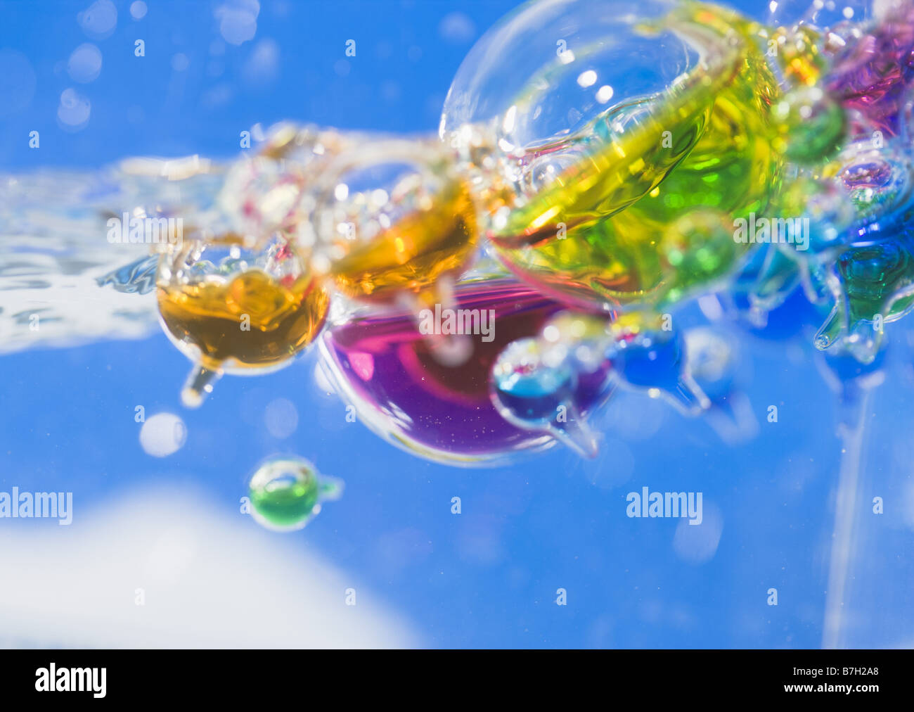 Glass balls floating on water Stock Photo - Alamy