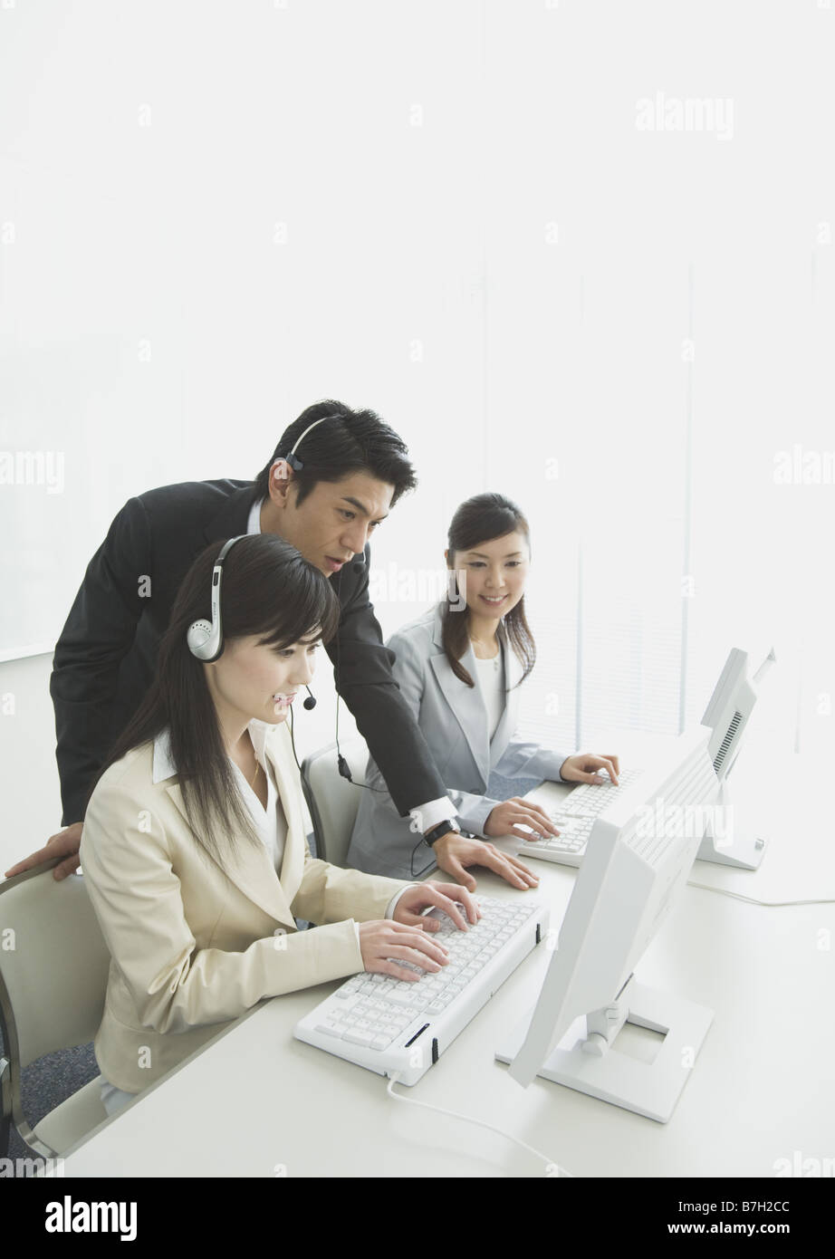 Operators, talking with a businessman, working in the office Stock ...