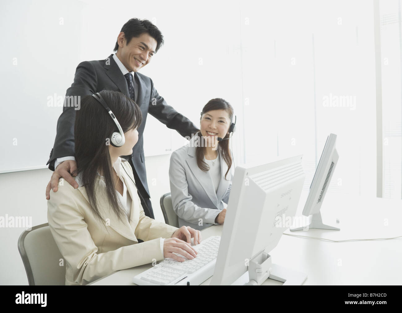 Operators, talking with a businessman, working in the office Stock ...