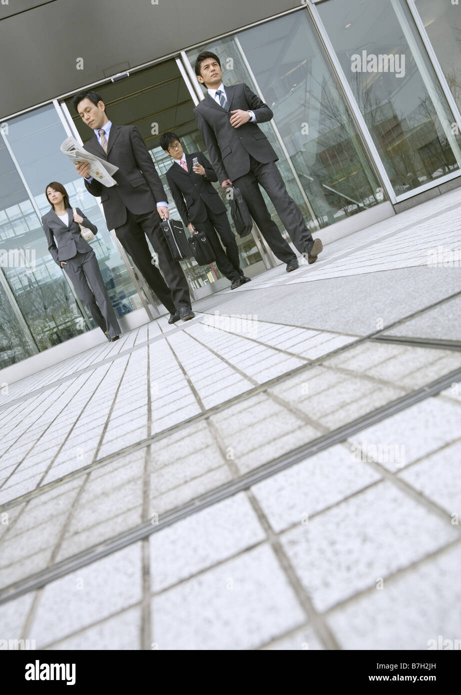 Group business people exiting building hi-res stock photography and ...