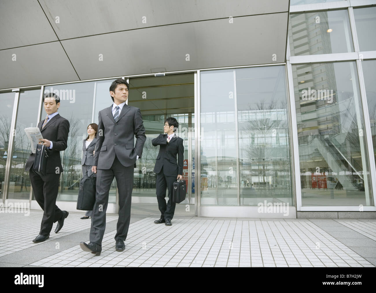 Group business people exiting building hi-res stock photography and ...