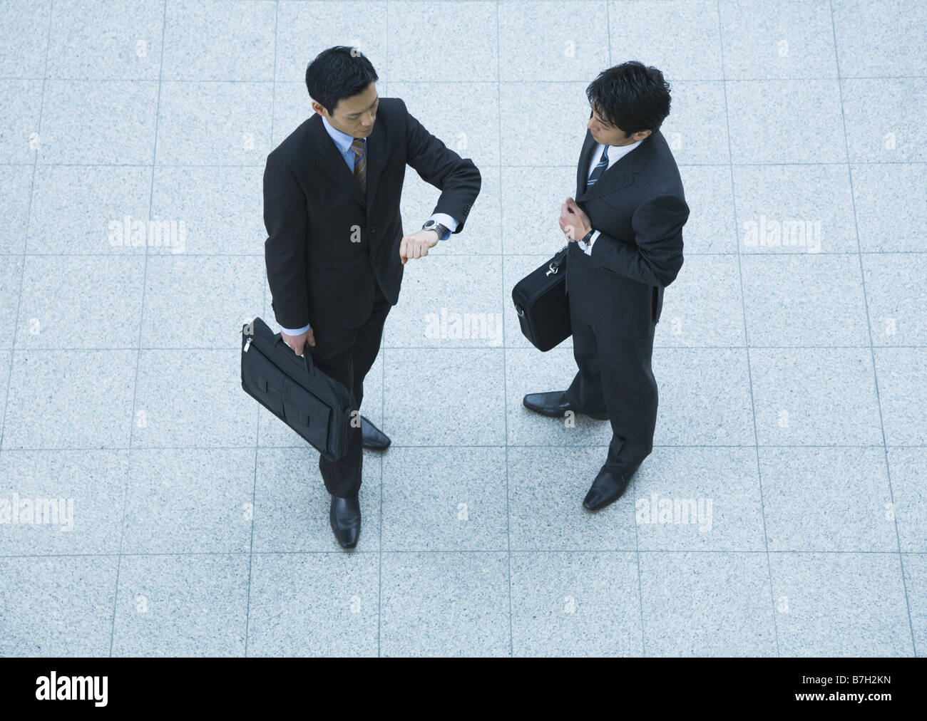 Businessmen in discussion Stock Photo - Alamy