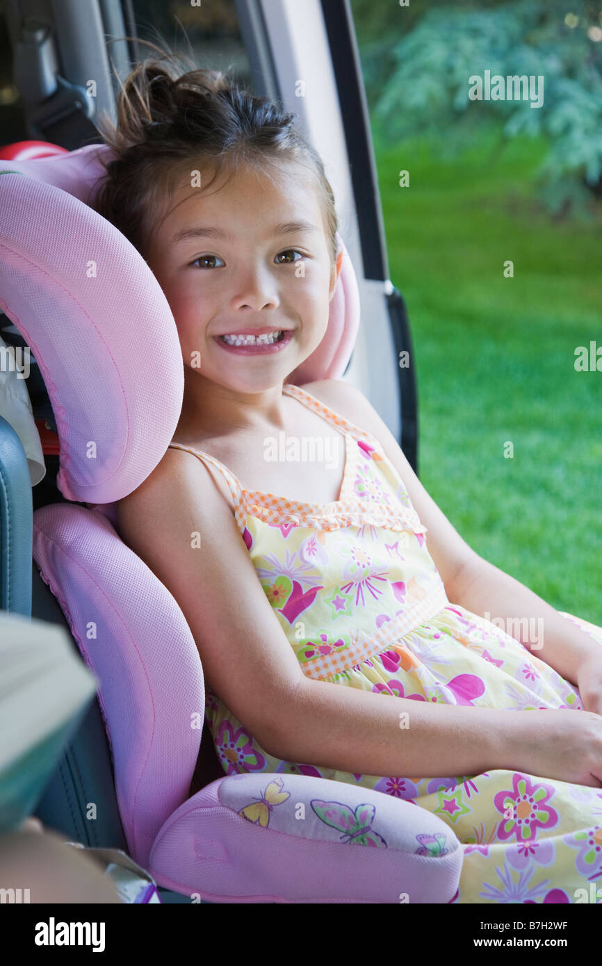 Asian girl sitting in car seat Stock Photo - Alamy