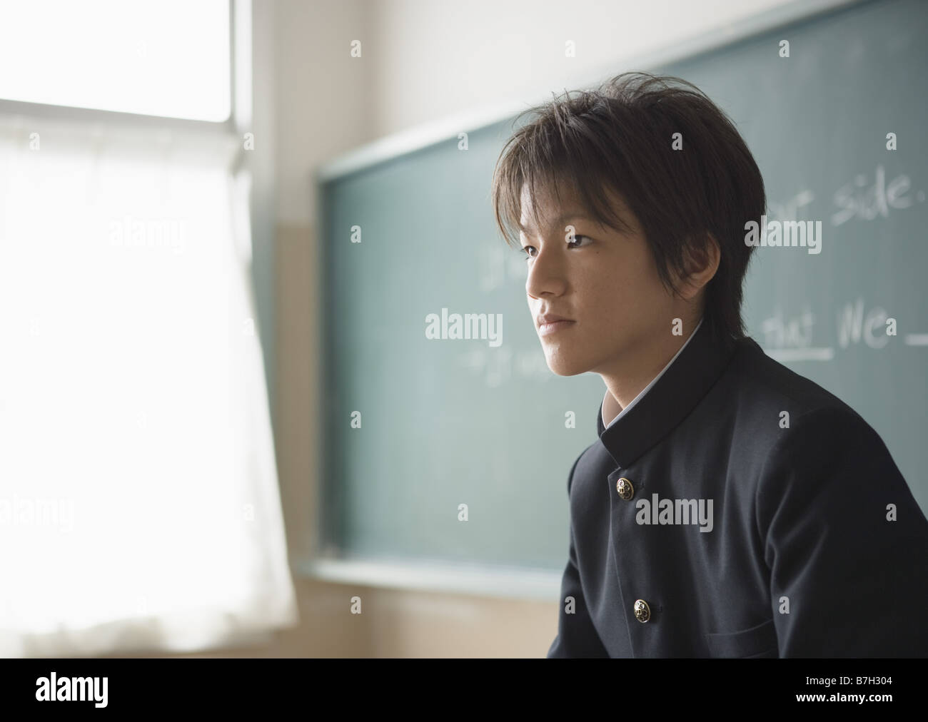 Teenageboy giving presentation in class Stock Photo - Alamy