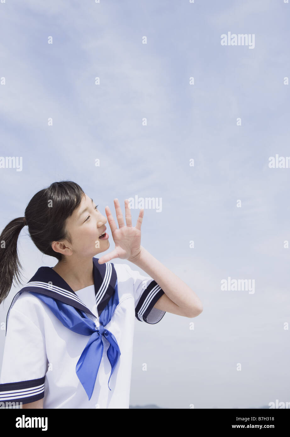 Teenagegirl in school uniform shouting Stock Photo - Alamy