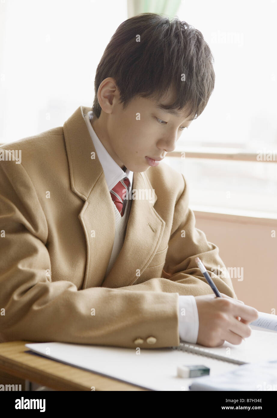 Student taking notes Stock Photo - Alamy