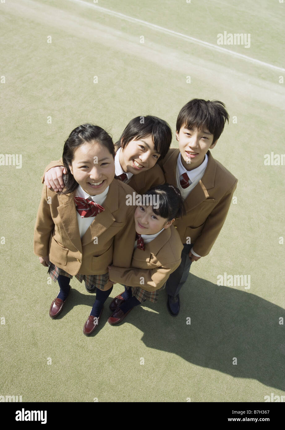 Group of students standing in athletic field Stock Photo - Alamy