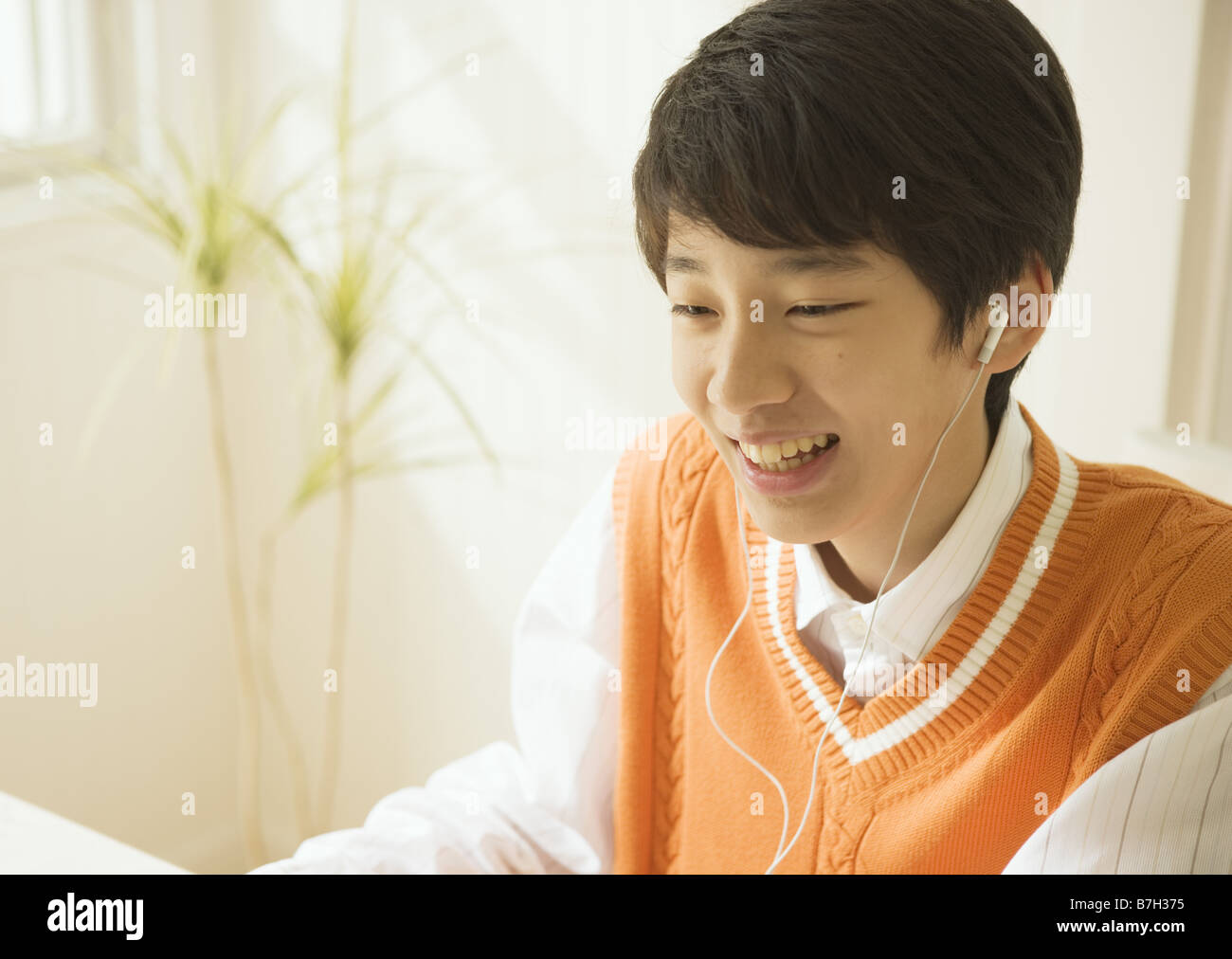 Boy listening to music Stock Photo - Alamy