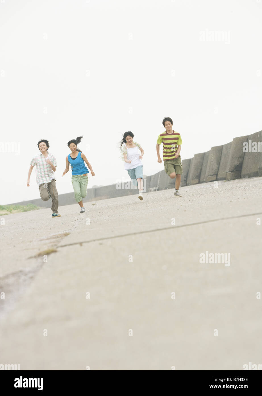 Running with friends Stock Photo - Alamy