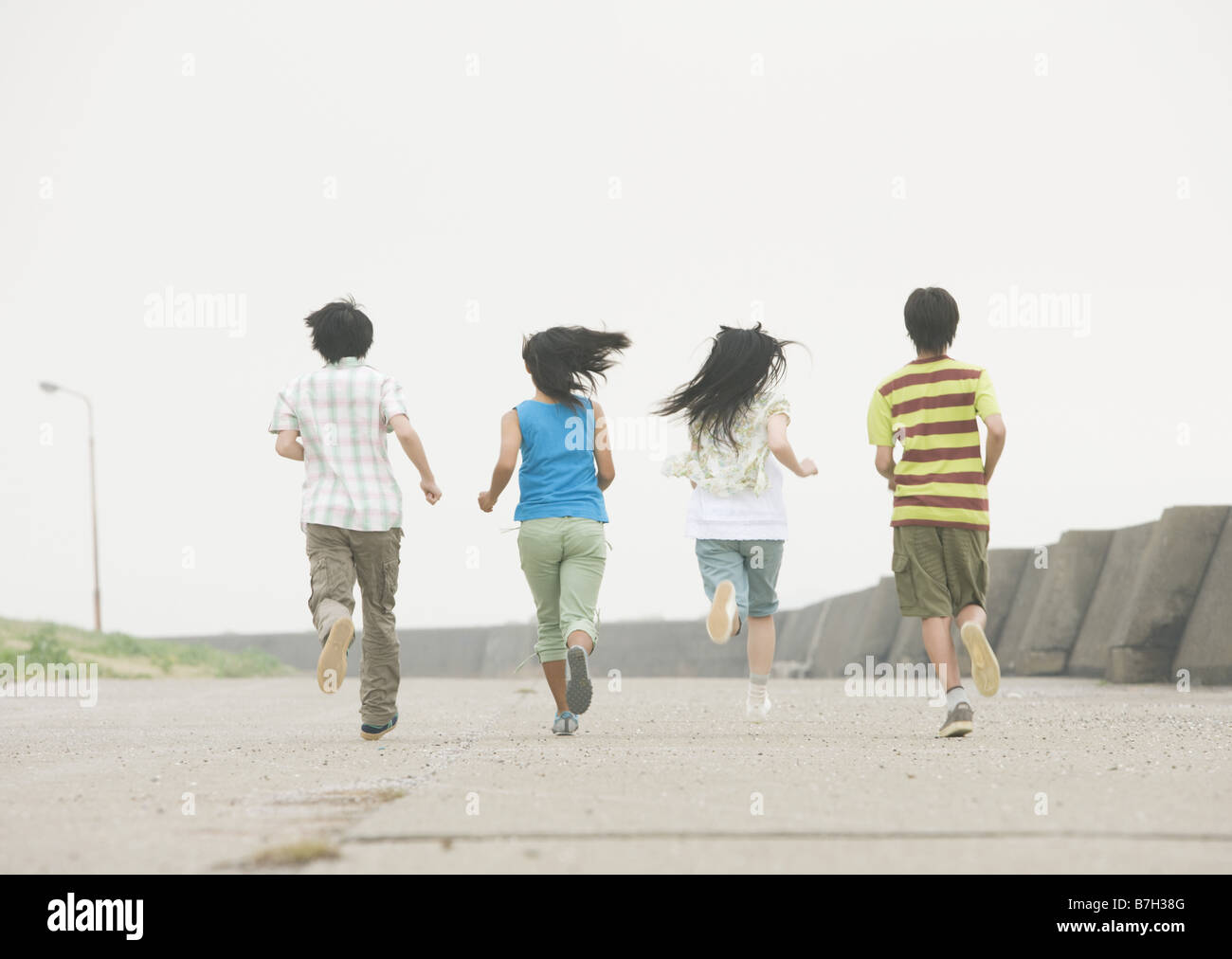Running with friends Stock Photo - Alamy
