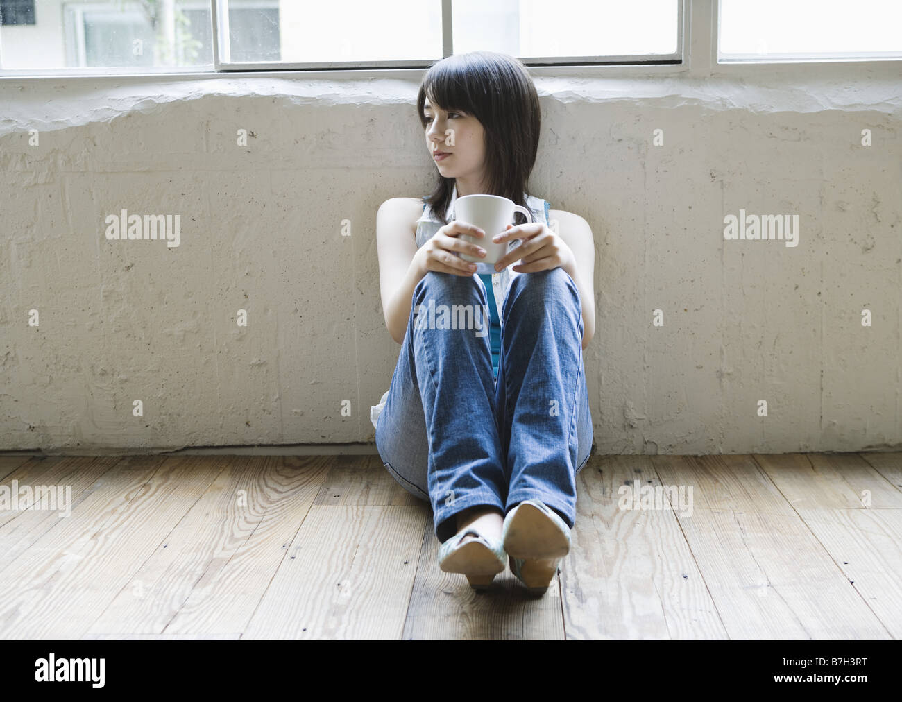 Girl having a coffee break Stock Photo - Alamy