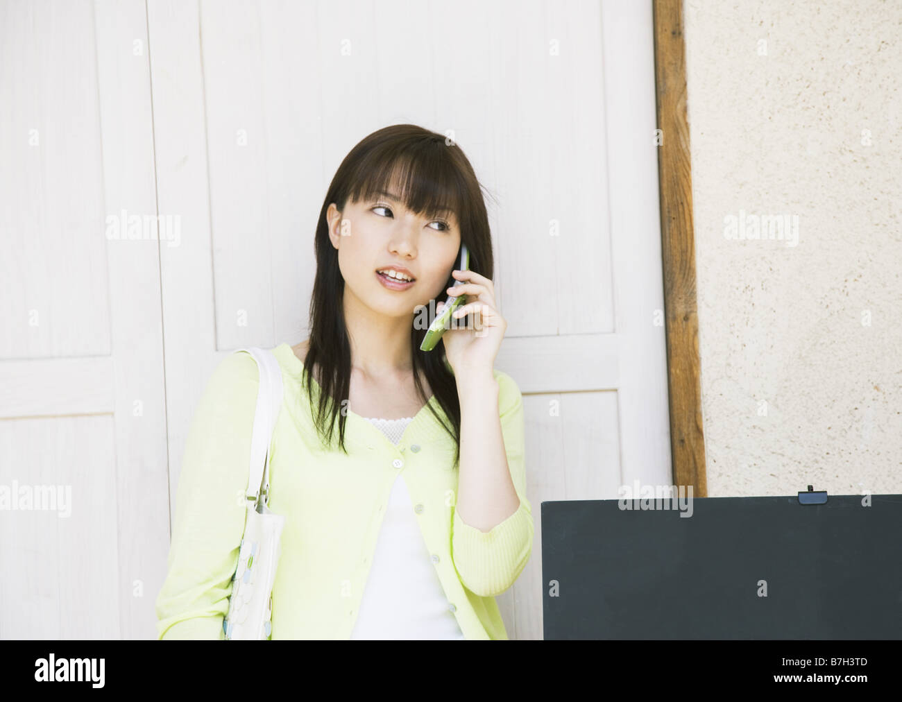 Girl using her cell phone Stock Photo - Alamy