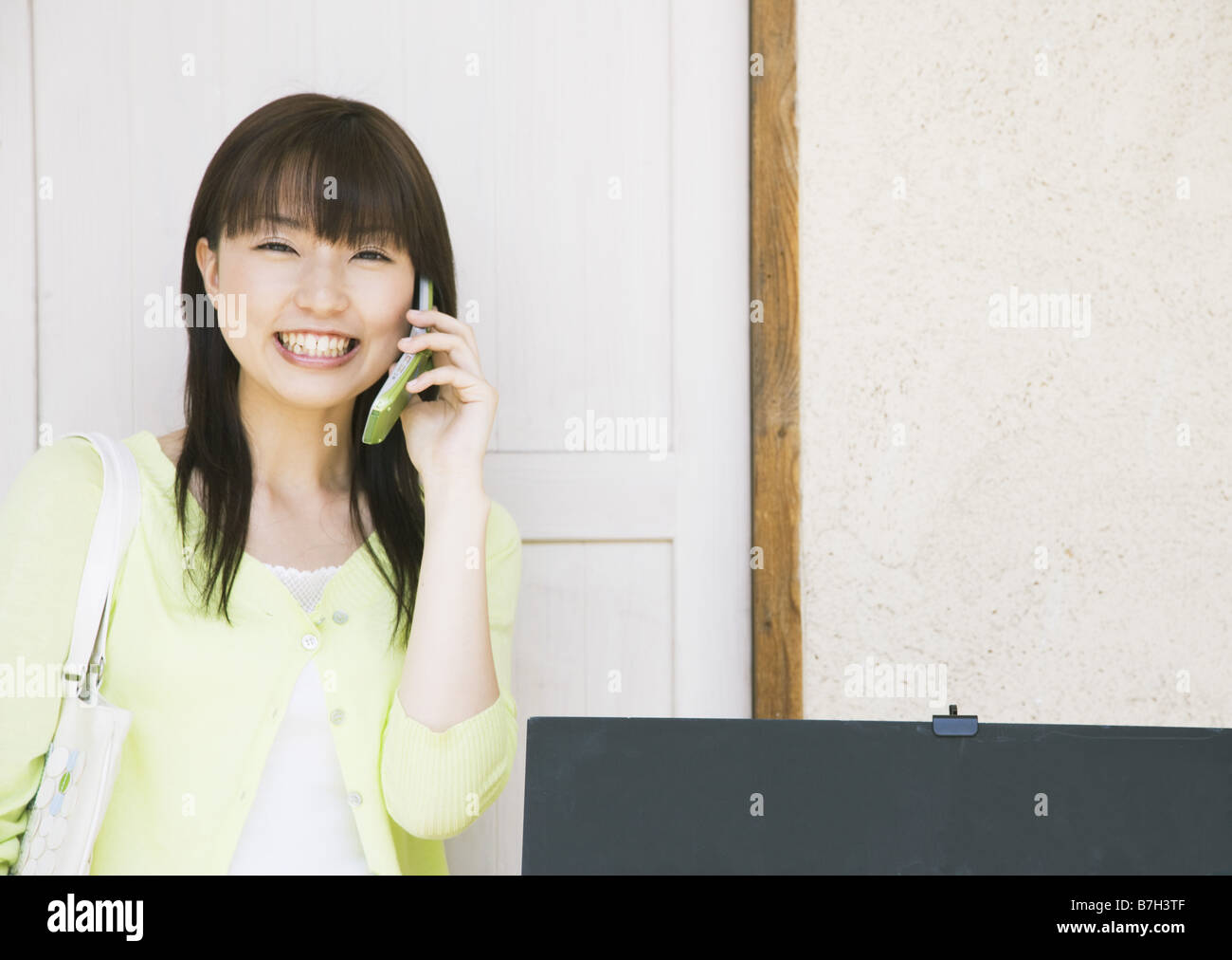 Girl using her cell phone Stock Photo - Alamy