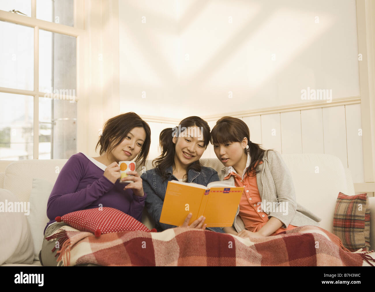 Women reading books in the room Stock Photo - Alamy