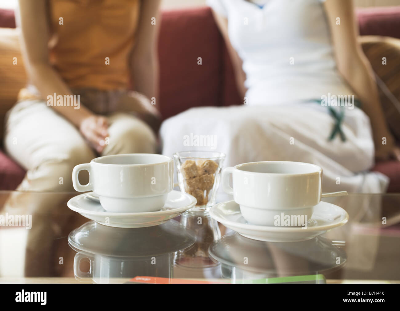 Young women having coffee break Stock Photo - Alamy