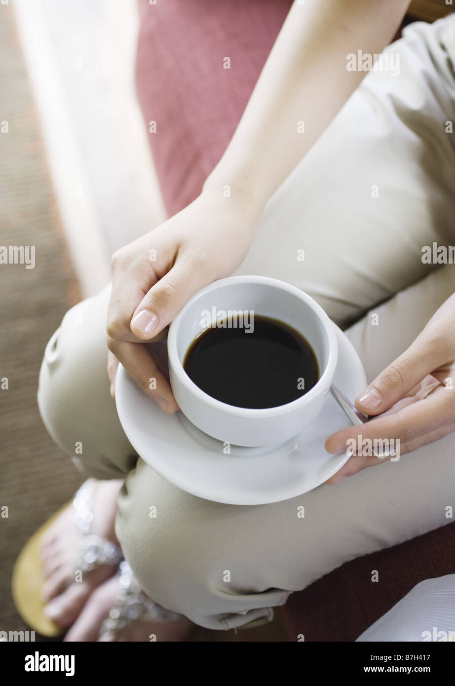 Woman having coffee break Stock Photo - Alamy
