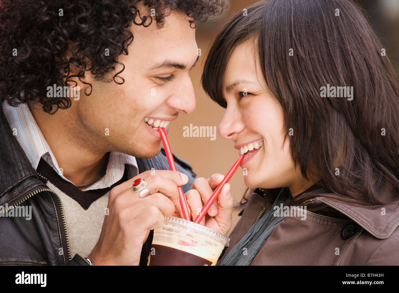 Young couple sharing milkshake hi-res stock photography and images - Alamy