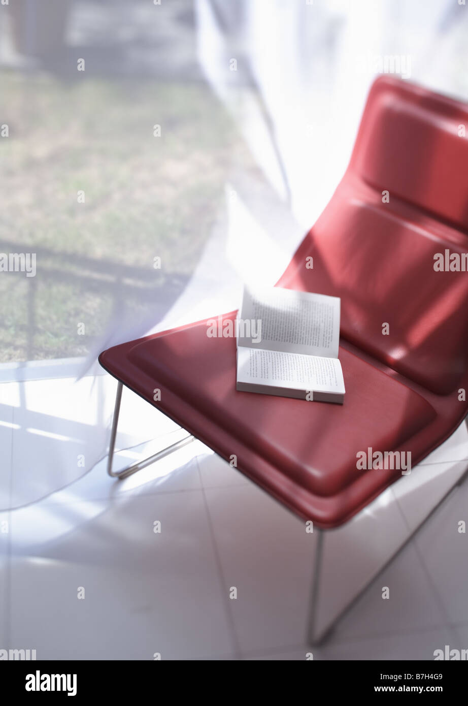 Book on chair Stock Photo - Alamy