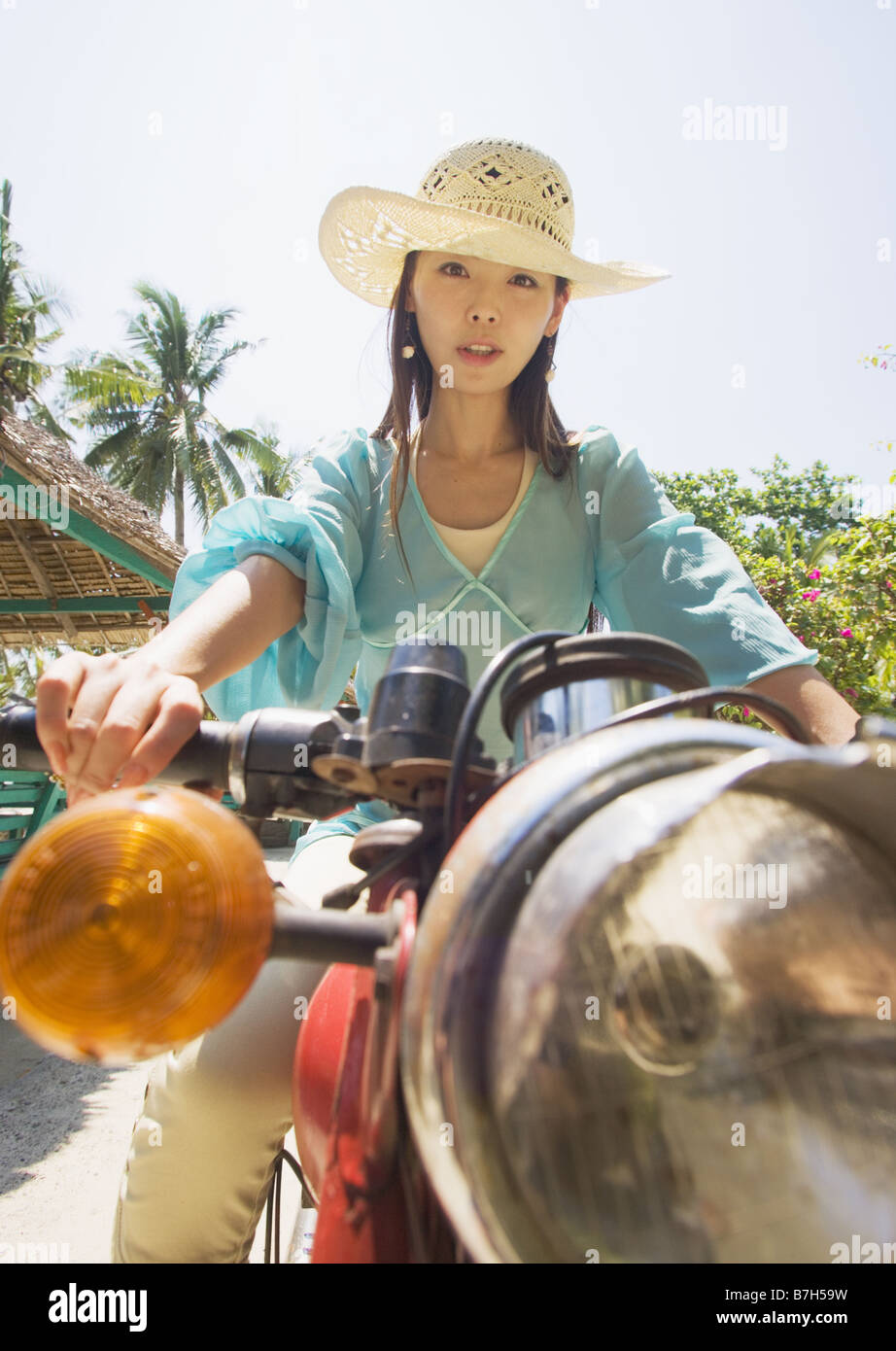 Woman riding on motorcycle Stock Photo - Alamy