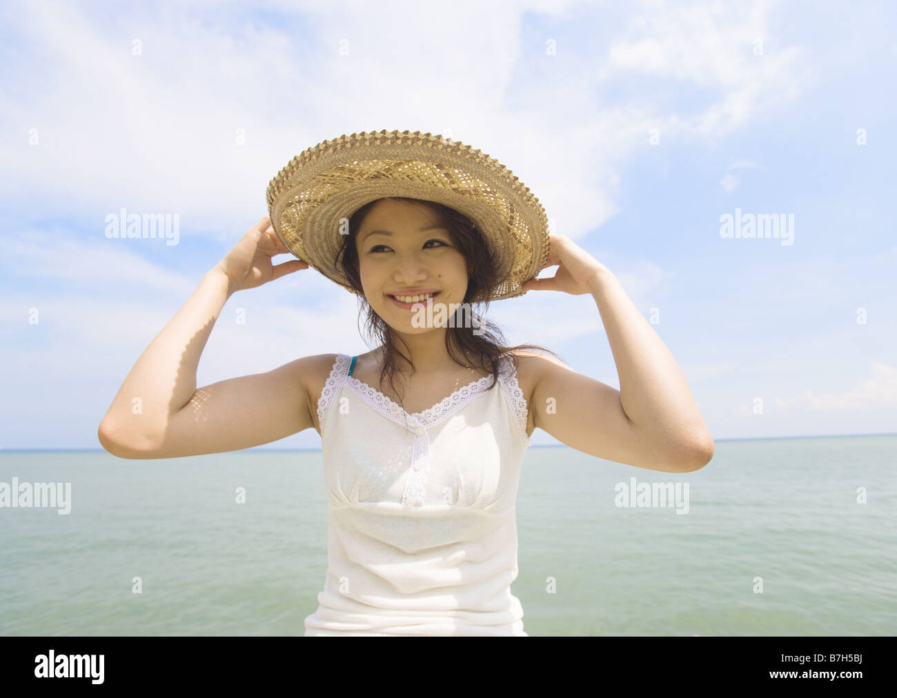Woman at seashore Stock Photo - Alamy