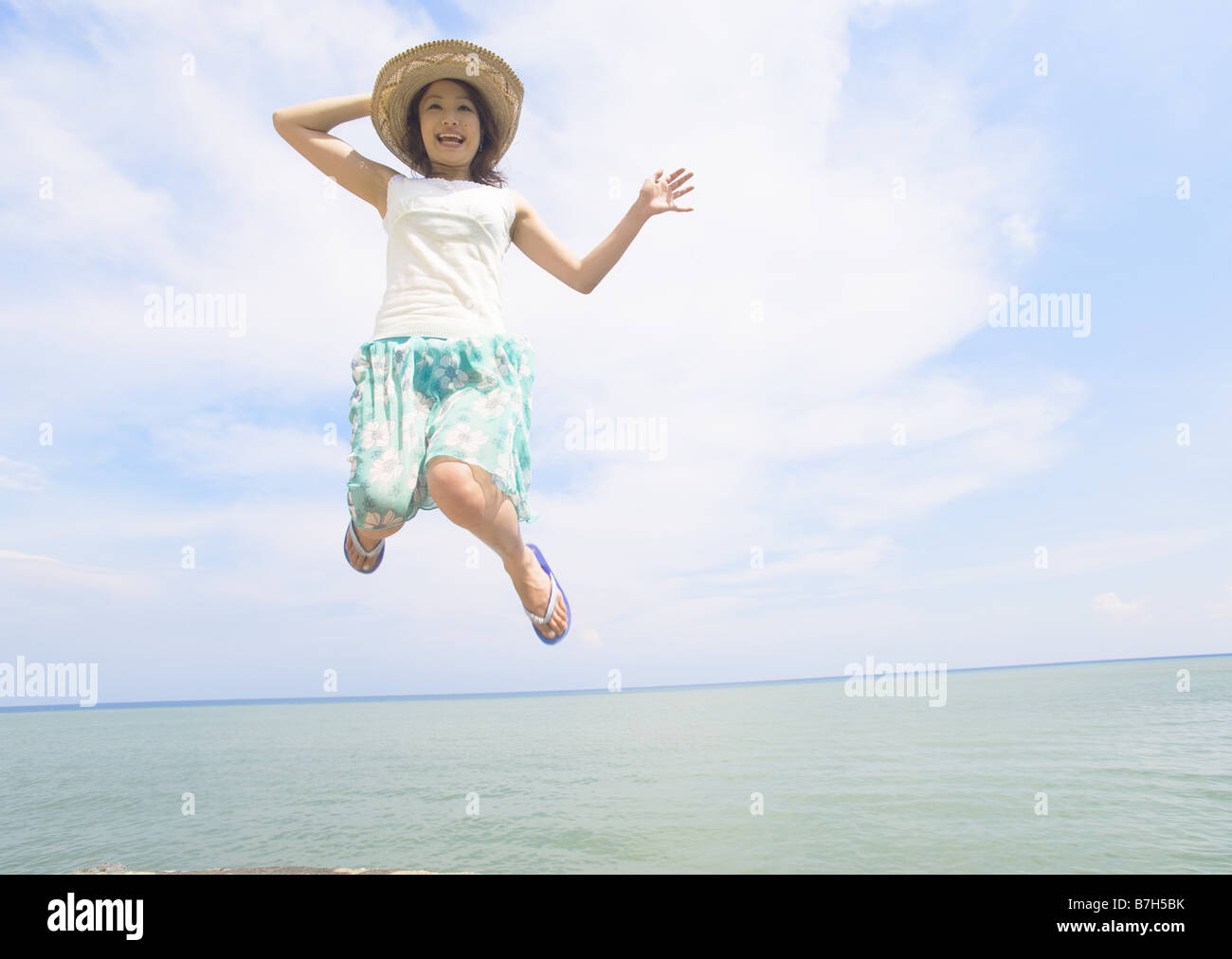 Woman at seashore Stock Photo - Alamy