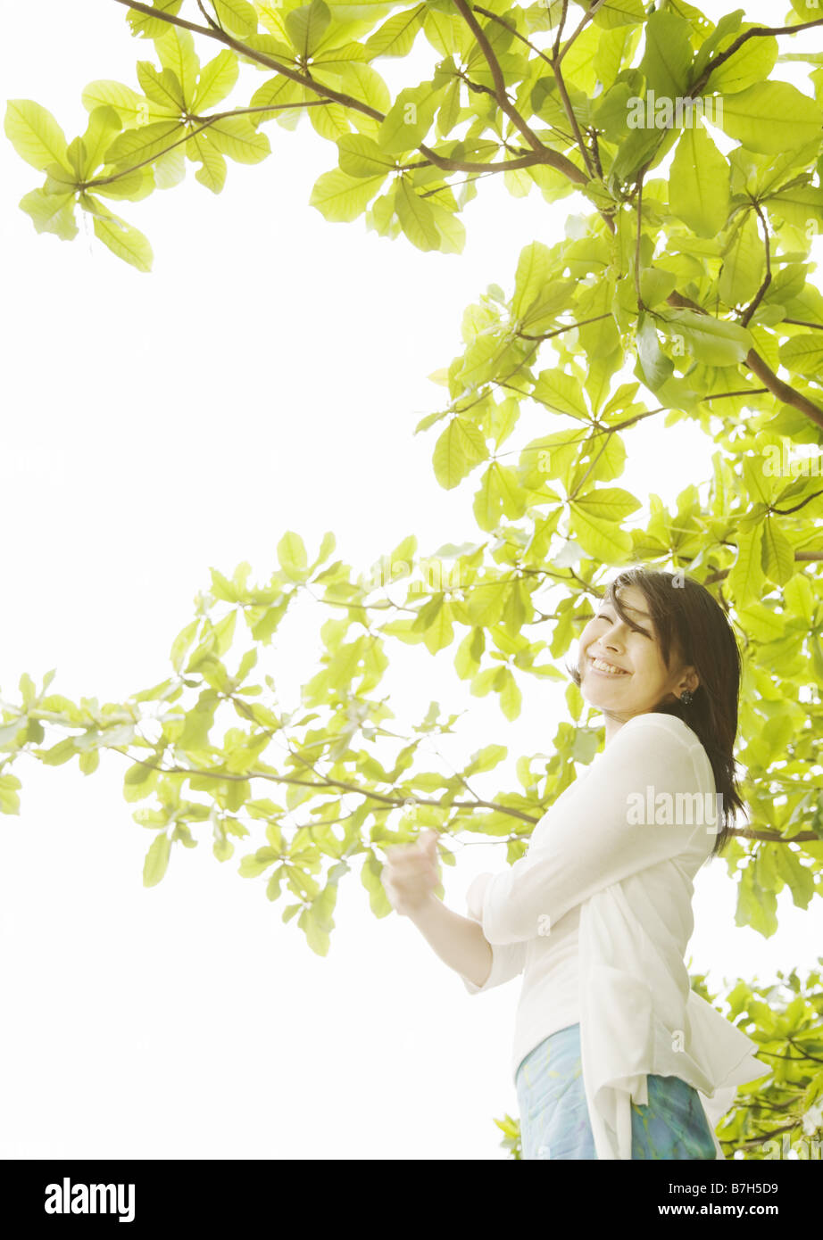 Woman and tree Stock Photo - Alamy