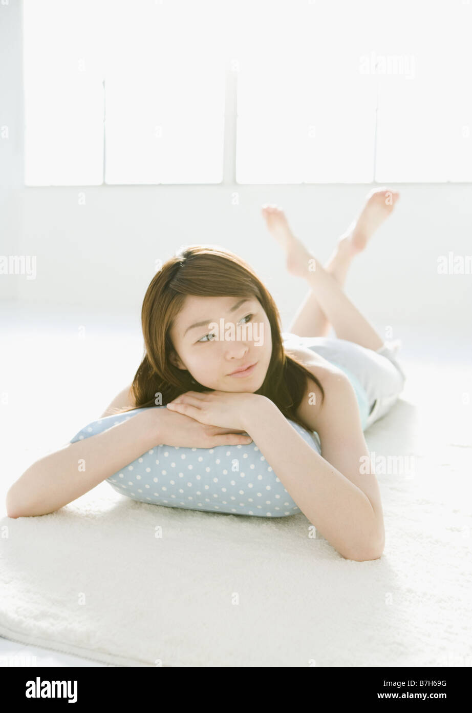 Woman Lying on the Floor Stock Photo - Alamy