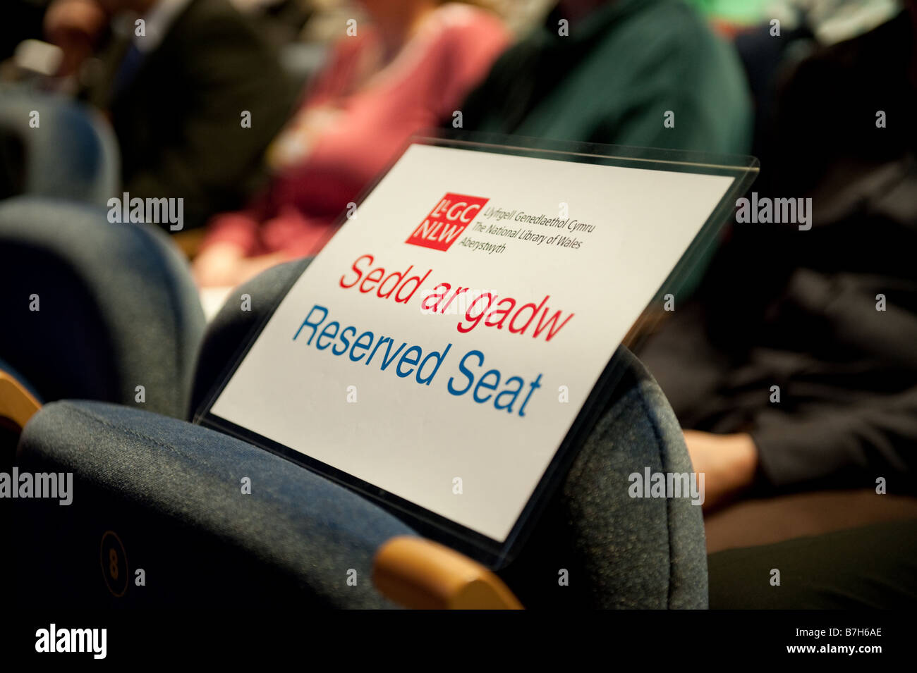Bilingual welsh english sign on a reserved seat at a conference at the ...