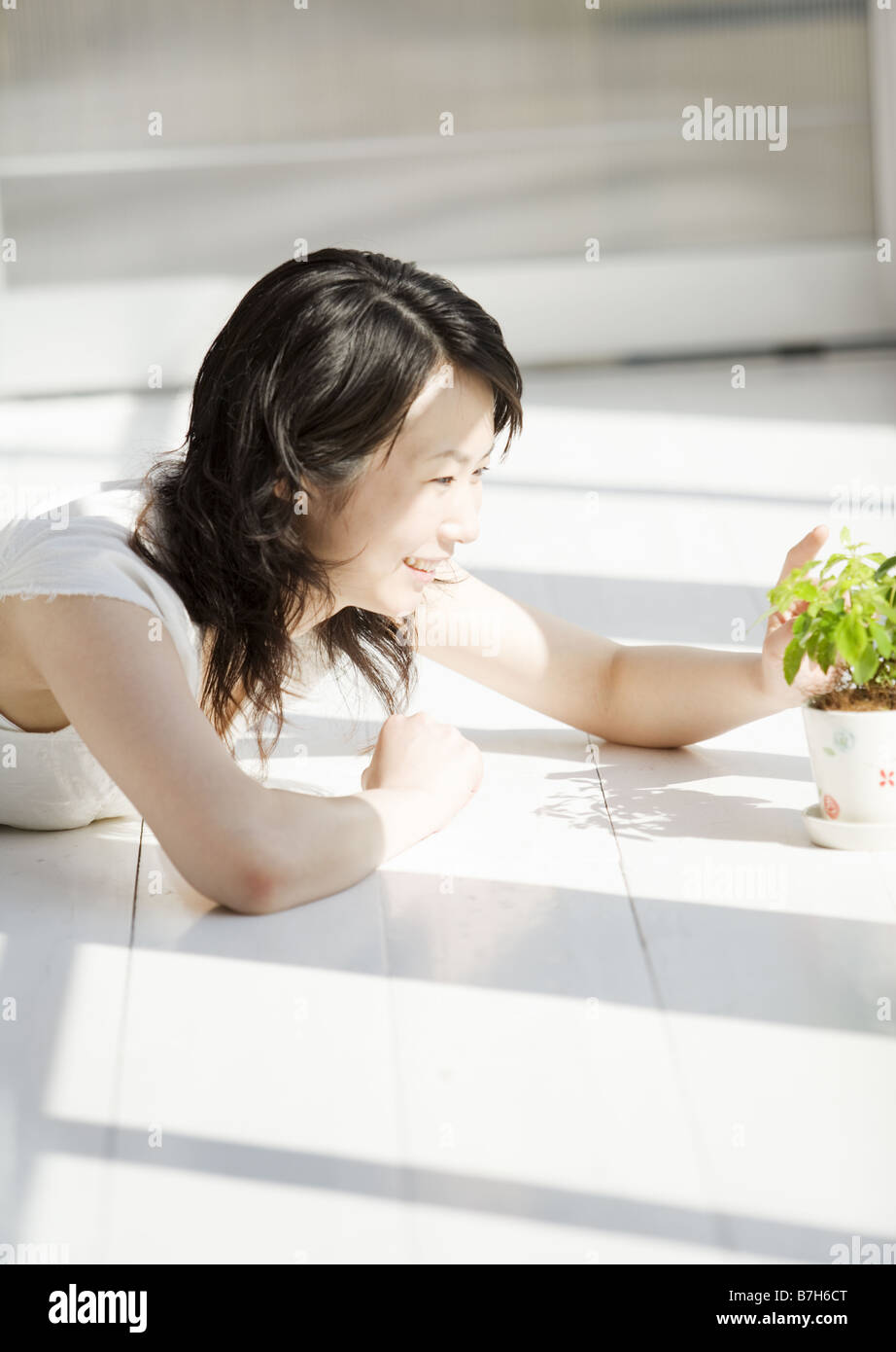 Woman Lying on Floor Stock Photo - Alamy