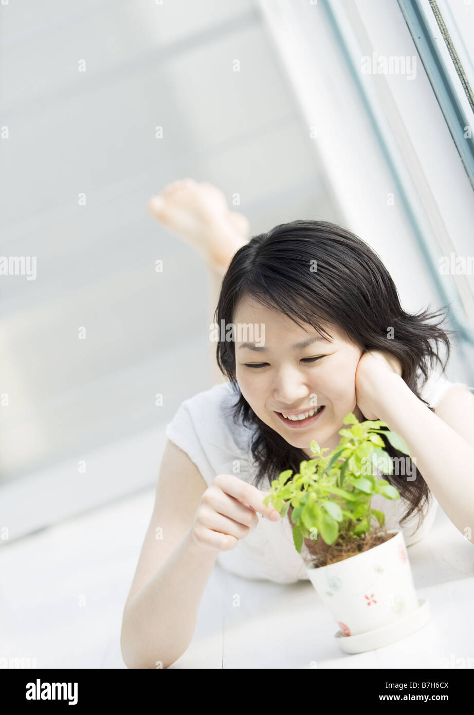 Woman Lying on Floor Stock Photo - Alamy