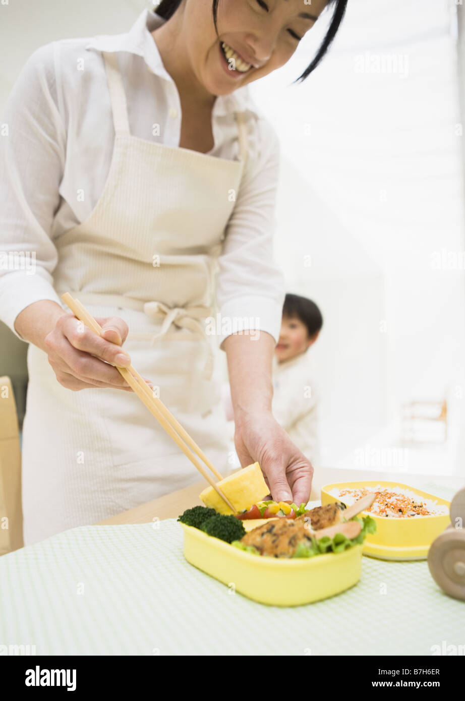 Woman Preparing Children's Lunch Stock Photo - Alamy