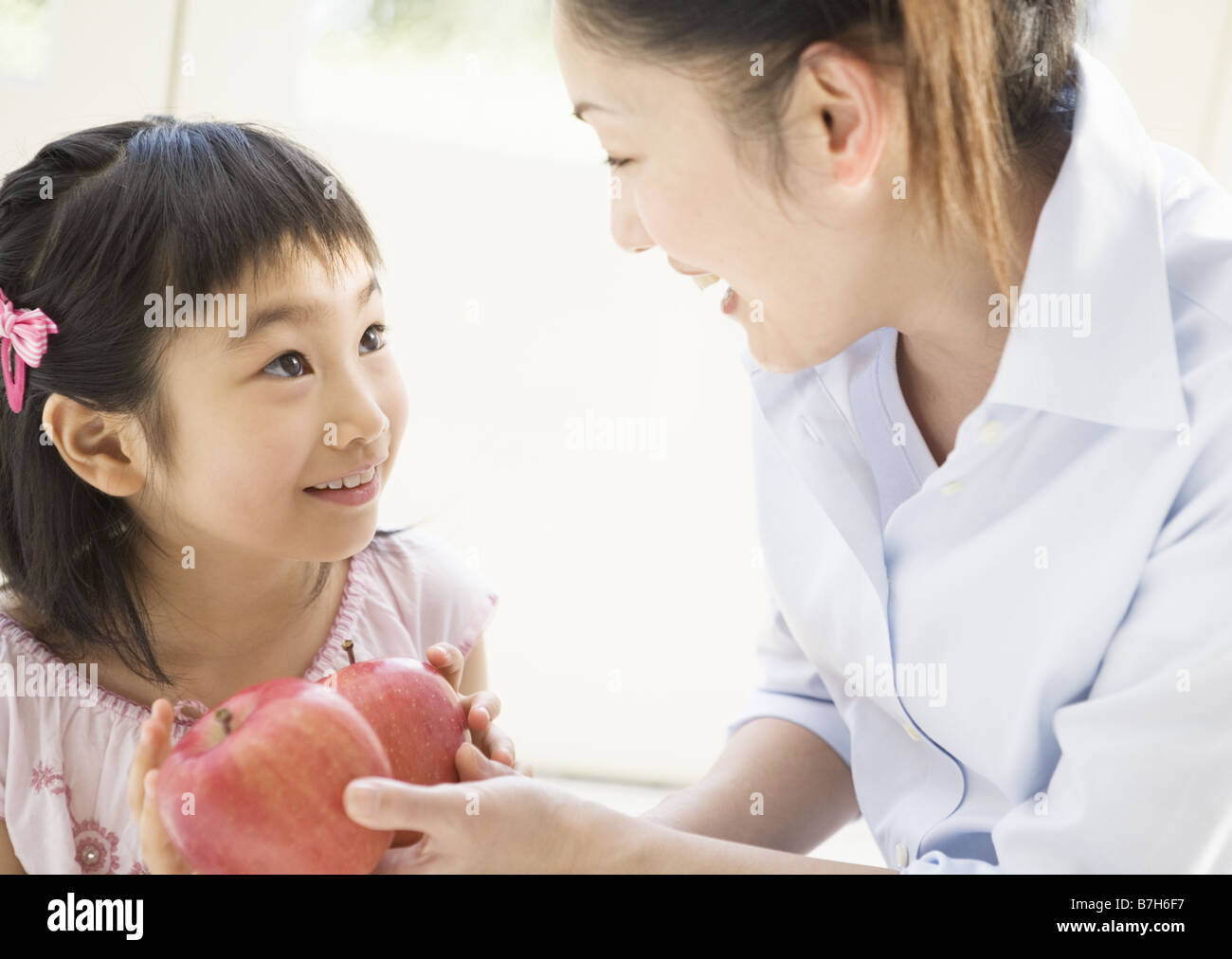 Girl Choosing Apple Stock Photo - Alamy