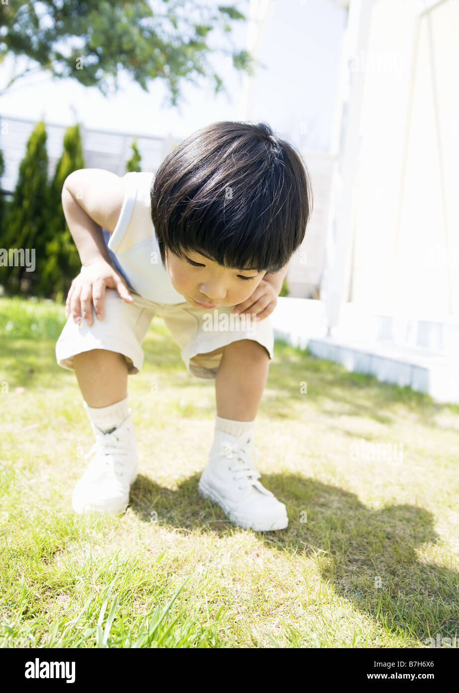 Boy Looking Down Stock Photo - Alamy