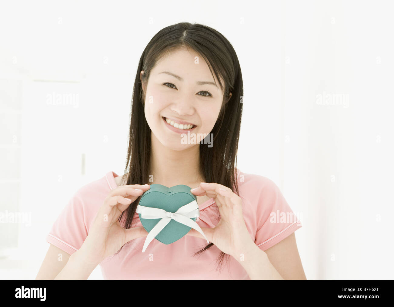 Woman Holding Present Stock Photo - Alamy
