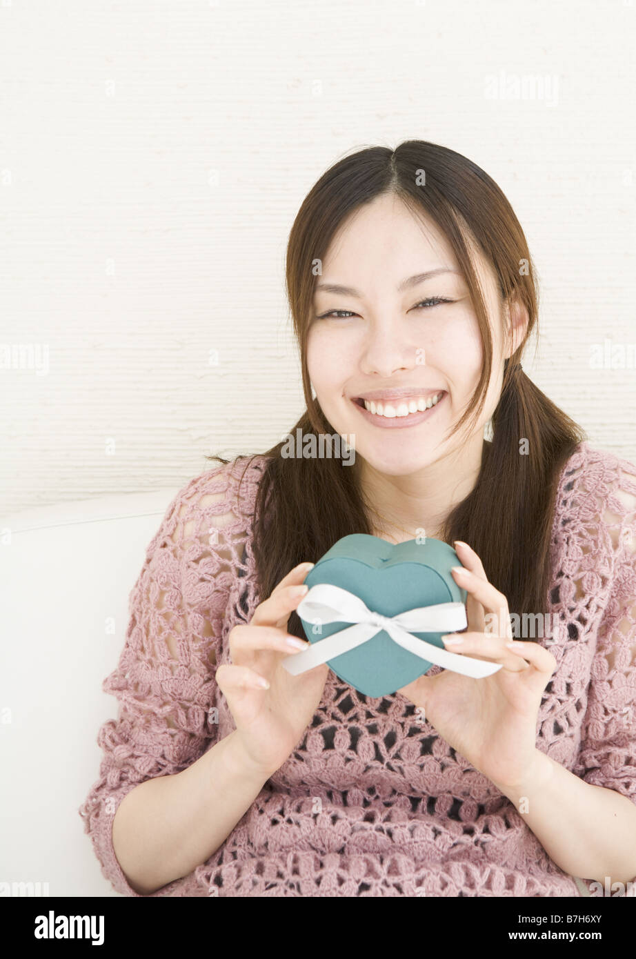 Woman Holding Present Stock Photo - Alamy