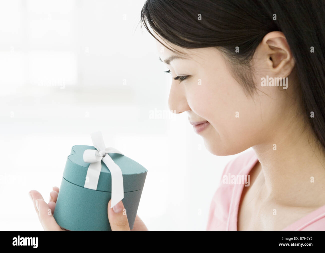 Woman with Present Stock Photo - Alamy
