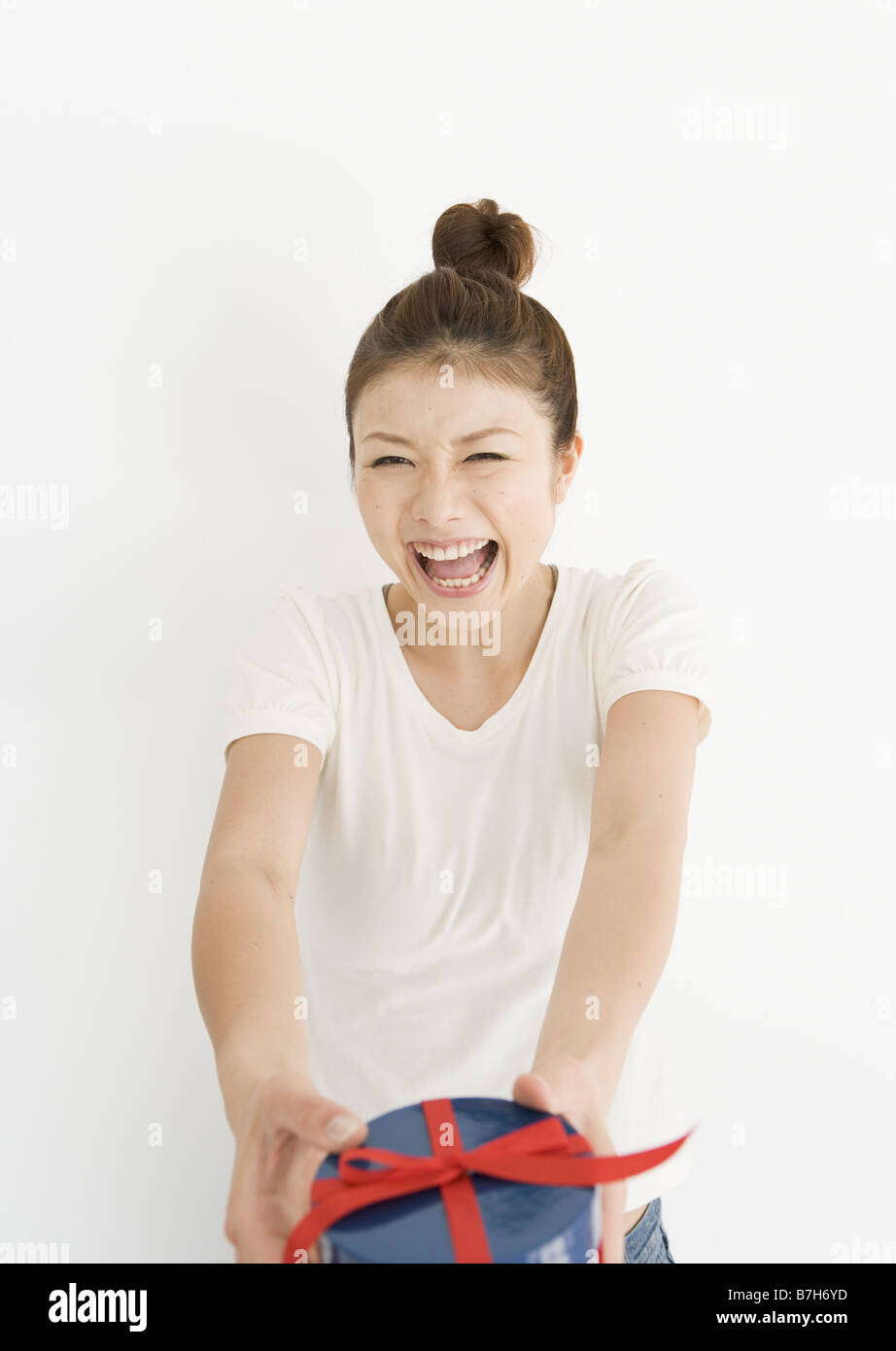 Woman Offering Present Stock Photo - Alamy