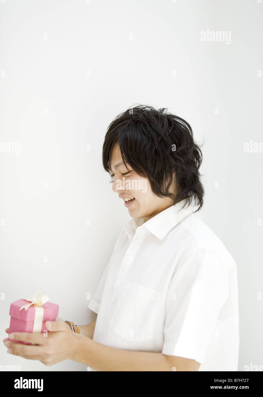 Man Holding Present Stock Photo - Alamy