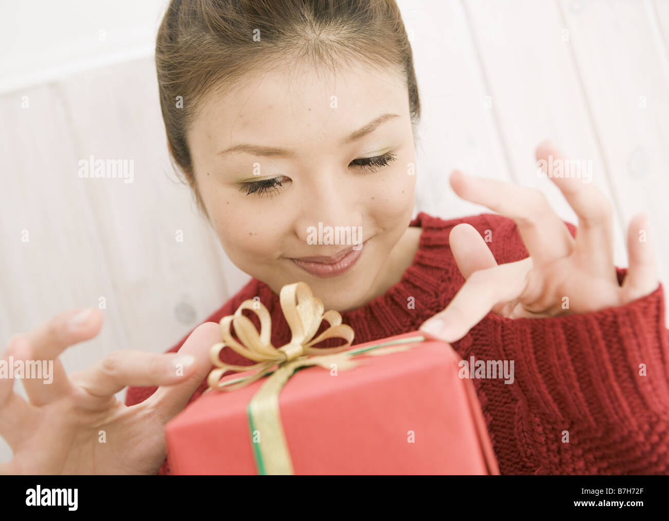 Woman with Present Stock Photo - Alamy