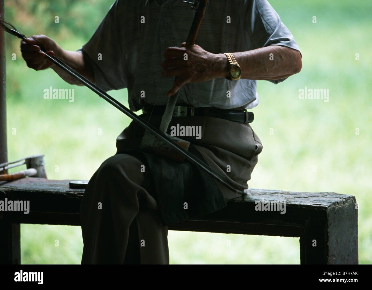 A man playing erhu Stock Photo - Alamy