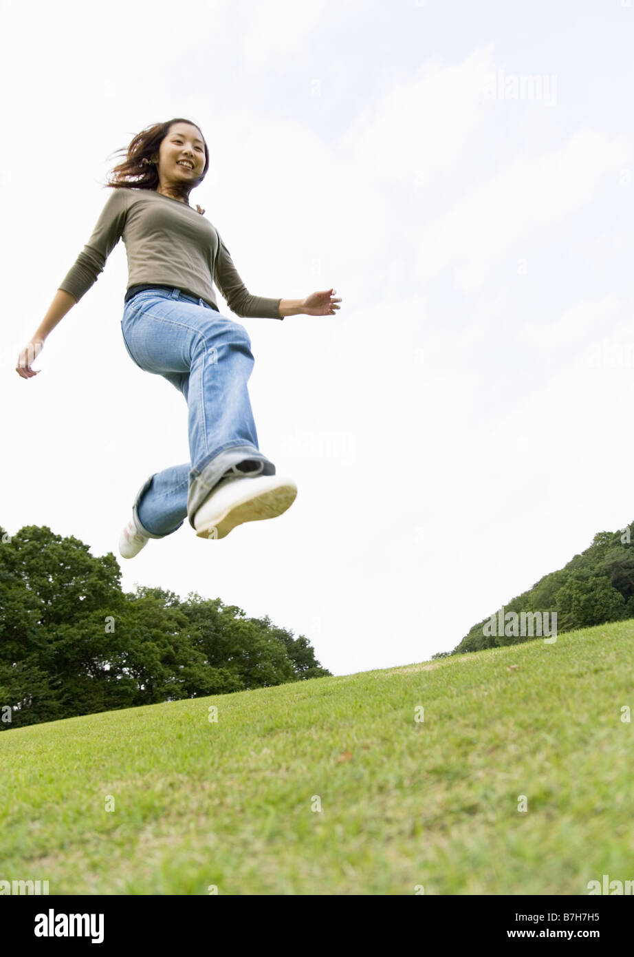 A jumping woman Stock Photo - Alamy