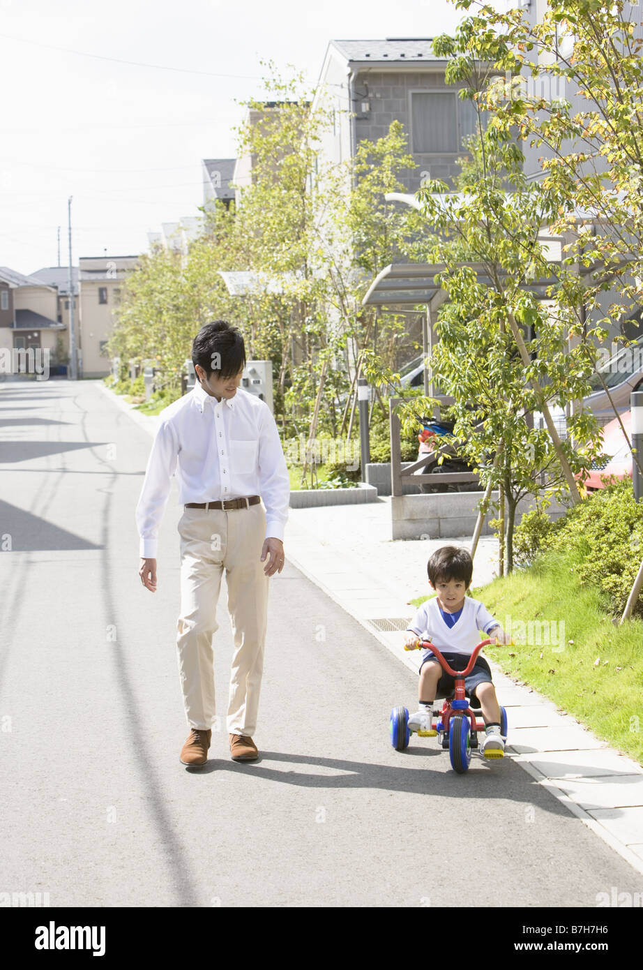 Father and son walking Stock Photo - Alamy