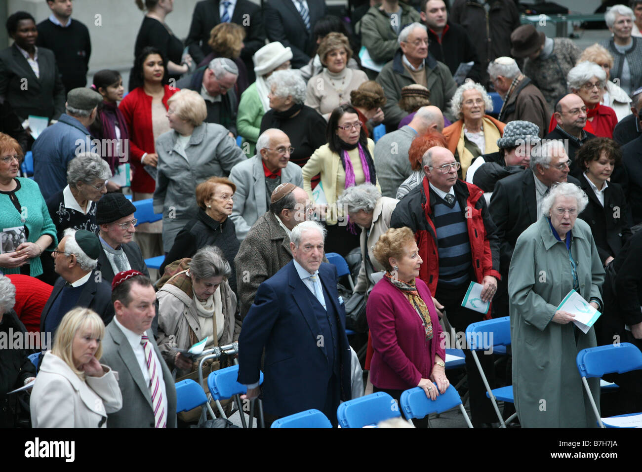 crowds and holocaust survivors watching speeches during the holocaust ...