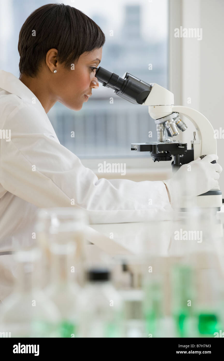 African scientist peering into microscope Stock Photo - Alamy African scientist peering into microscope Stock Photo - Alamy