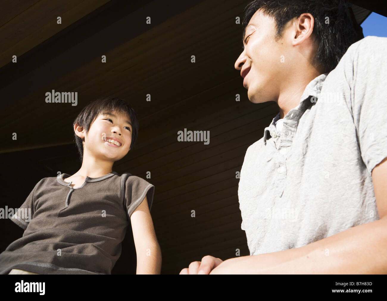 Father and son talking Stock Photo - Alamy