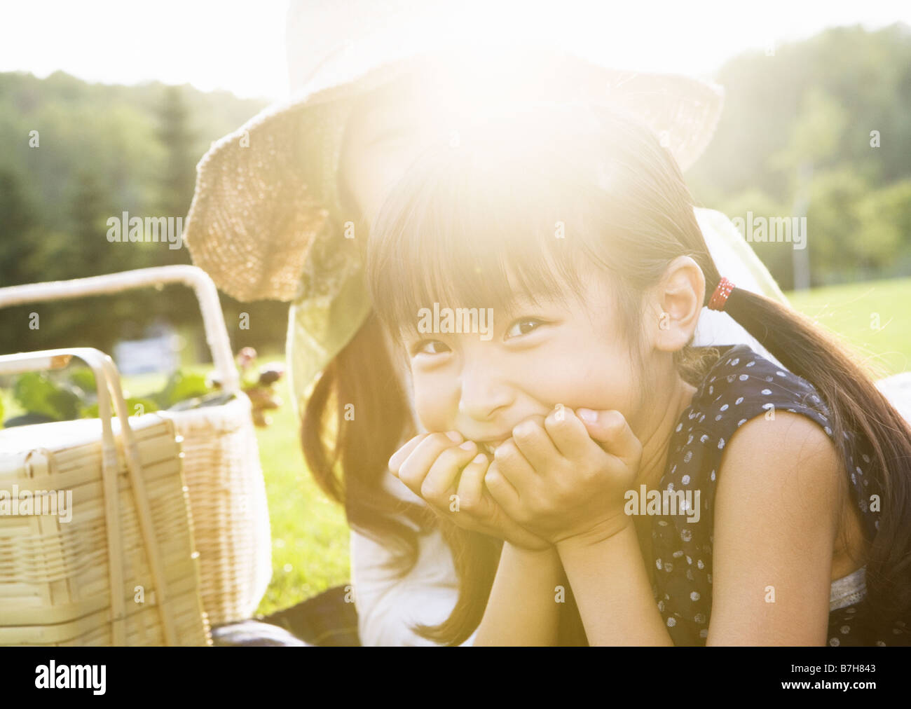 Mother and daughter smiling Stock Photo - Alamy